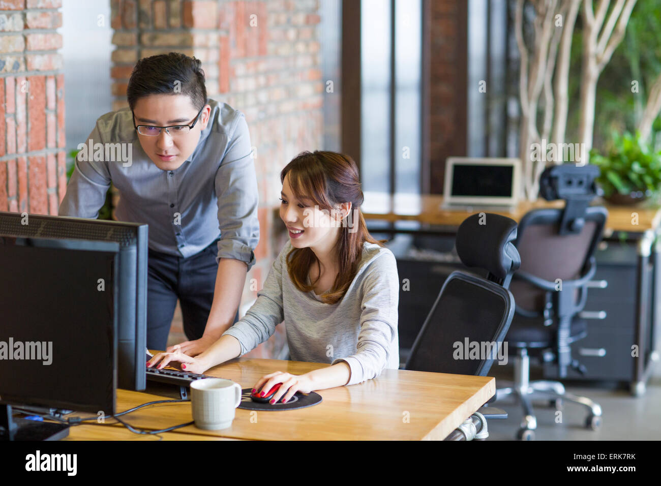 IT workers working in office Stock Photo - Alamy