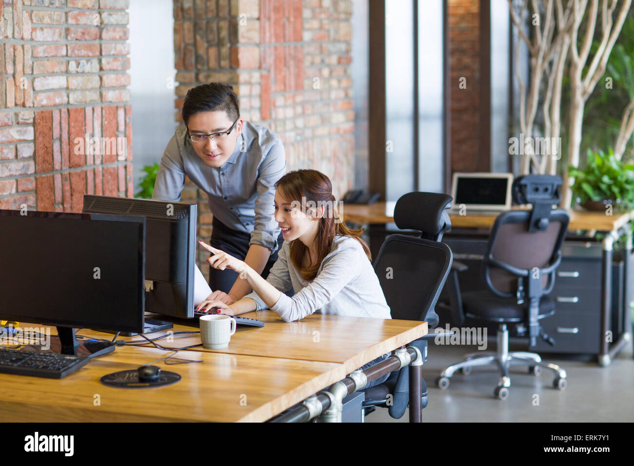 IT workers working in office Stock Photo - Alamy