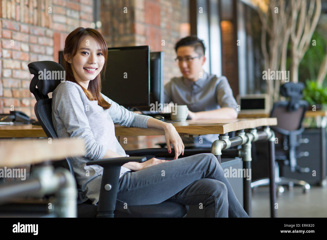 IT workers sitting in office Stock Photo - Alamy
