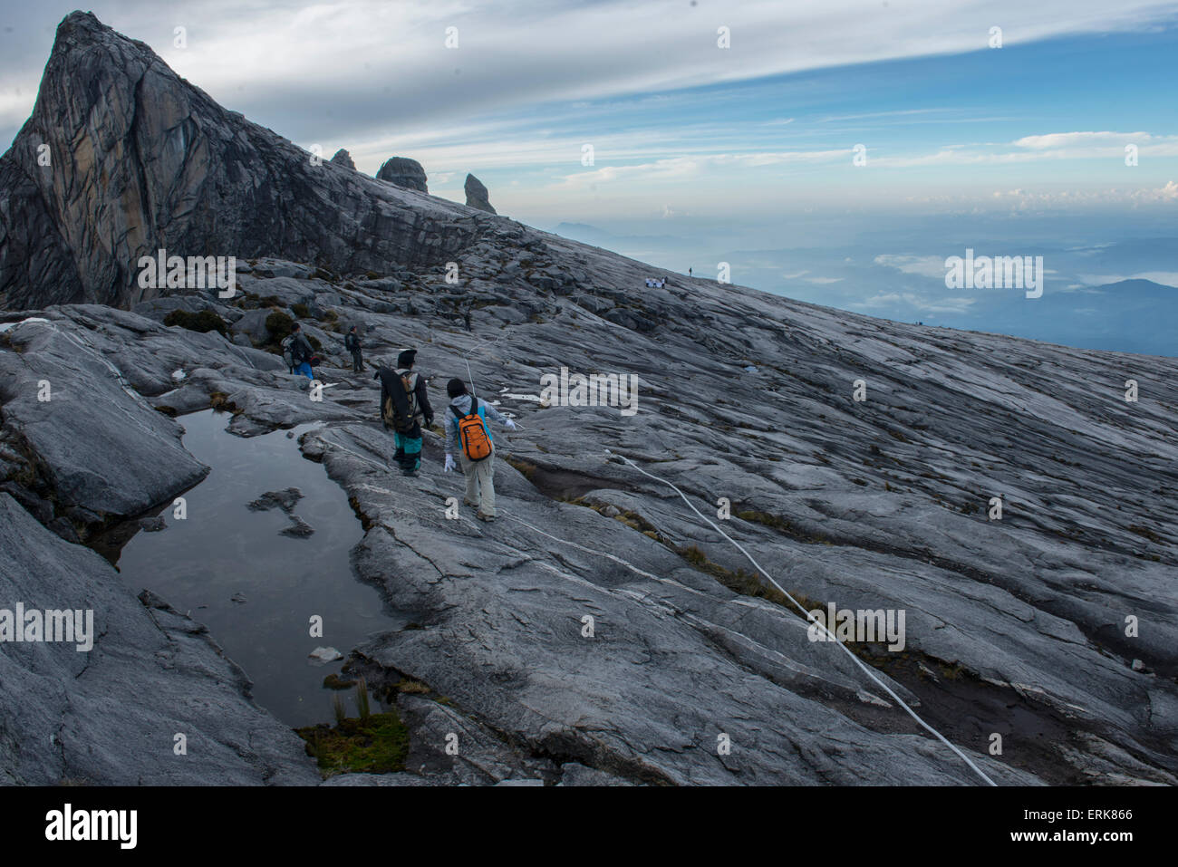 Guide and girl walk on the peak, Low's Peak, Mount Kinabalu, Sabah ...