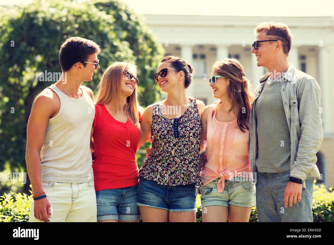 Laughing group smiling friends hugging hi-res stock photography and ...