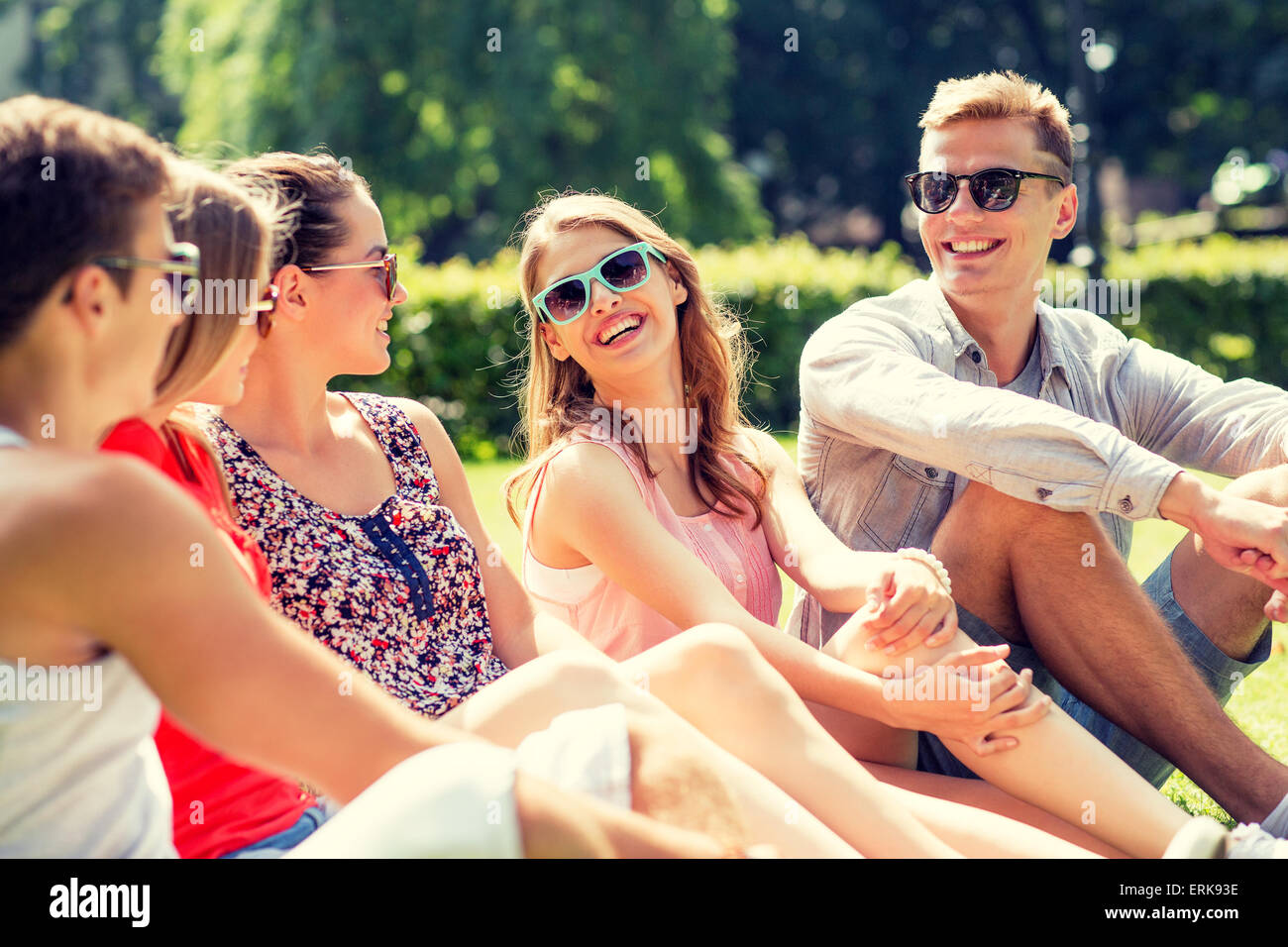 Group of young friends out in the park together hi-res stock ...