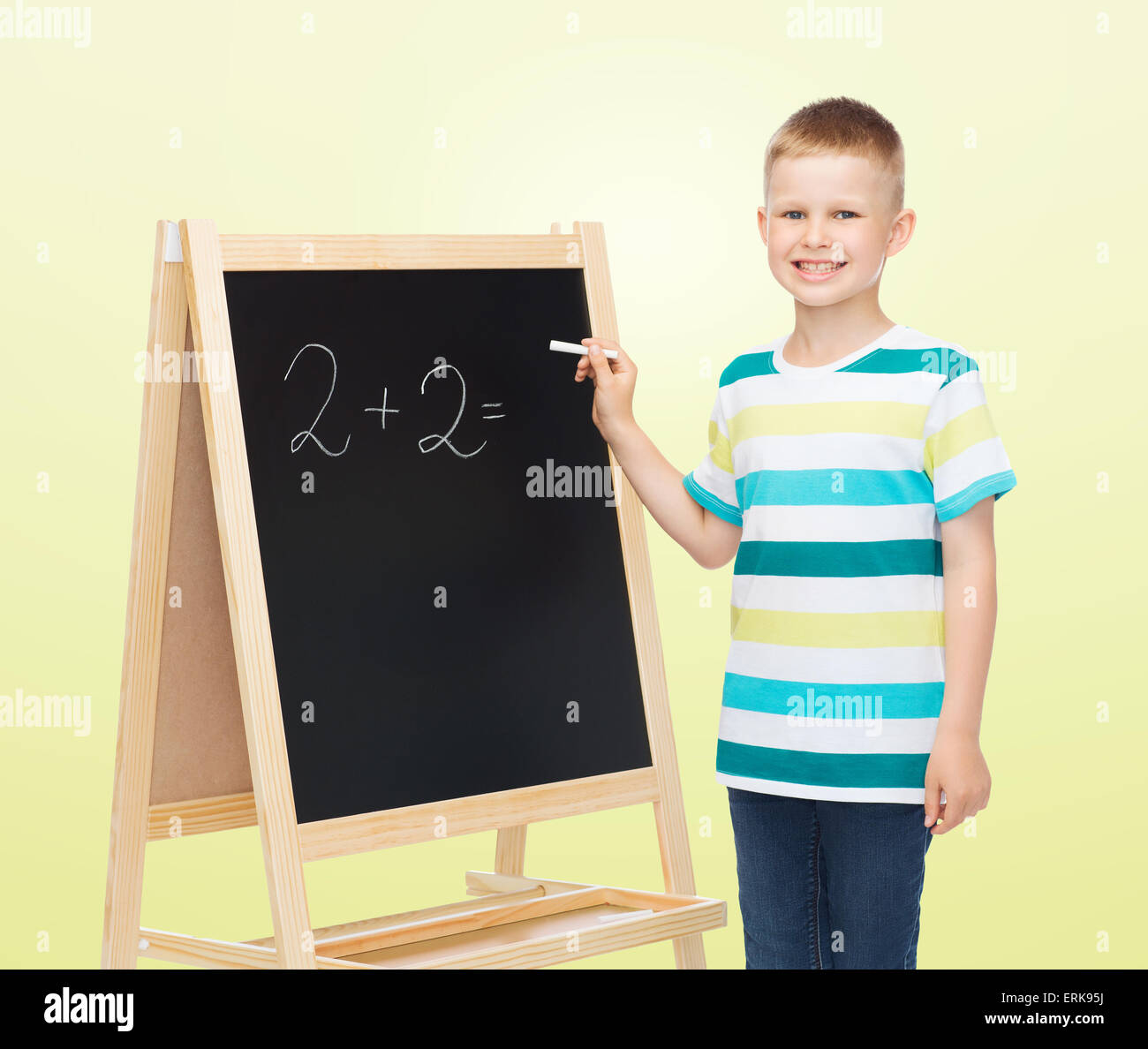 happy little boy with blackboard and chalk Stock Photo - Alamy