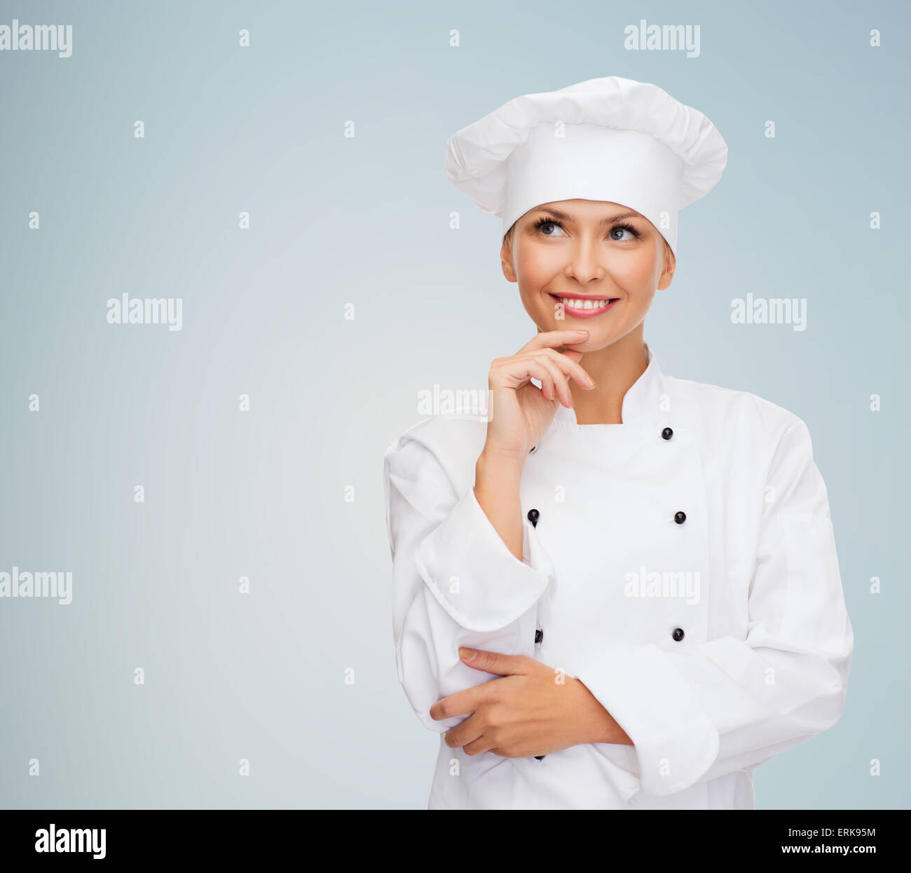 smiling female chef dreaming Stock Photo - Alamy