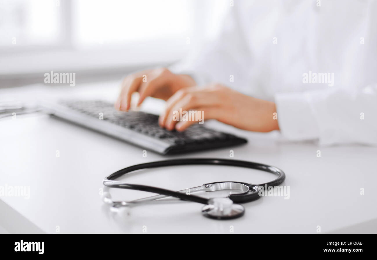 male doctor typing on the keyboard Stock Photo - Alamy