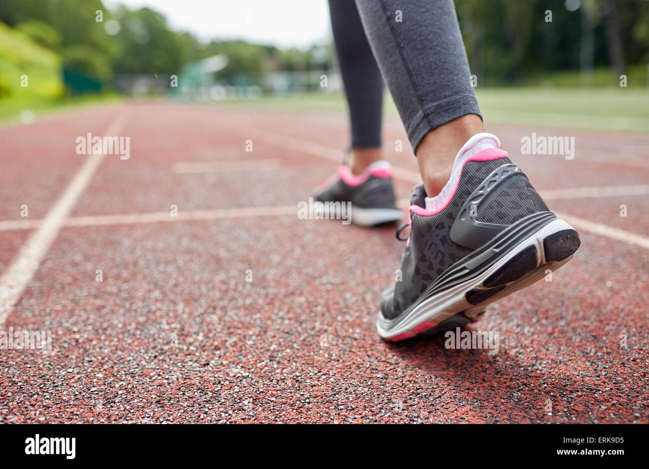 close up of woman feet running on track from back Stock Photo - Alamy