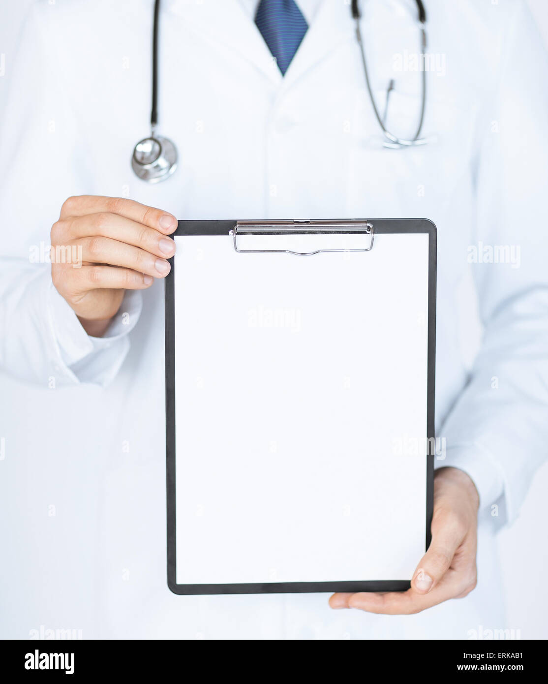 doctor holding blank white paper Stock Photo - Alamy