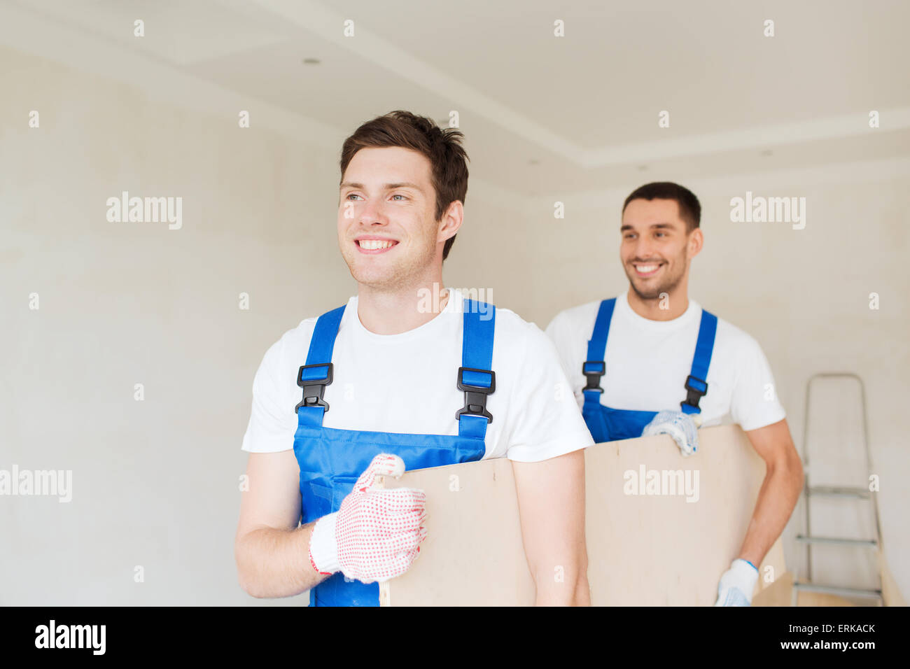 group of builders with wooden boards Stock Photo - Alamy