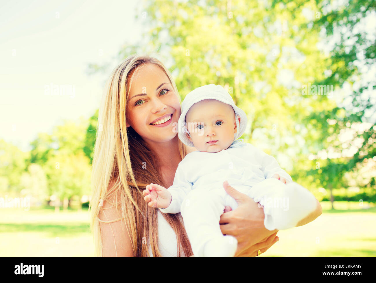 happy mother with little baby in park Stock Photo - Alamy