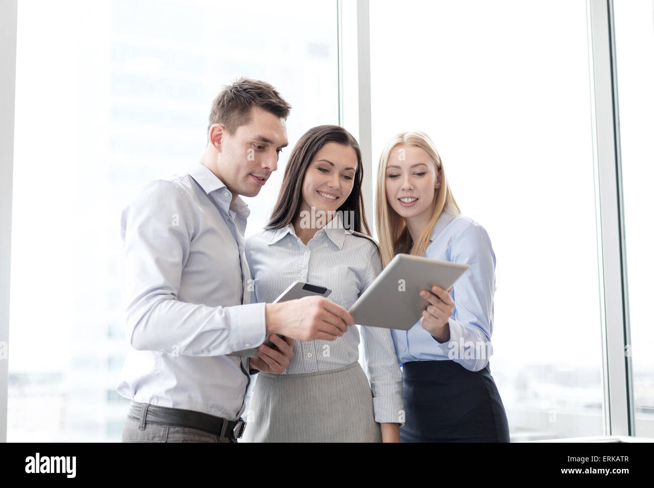 business team working with tablet pcs in office Stock Photo - Alamy
