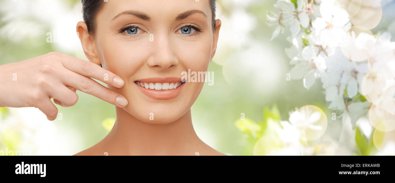 face and hand of smiling woman over summer garden Stock Photo - Alamy