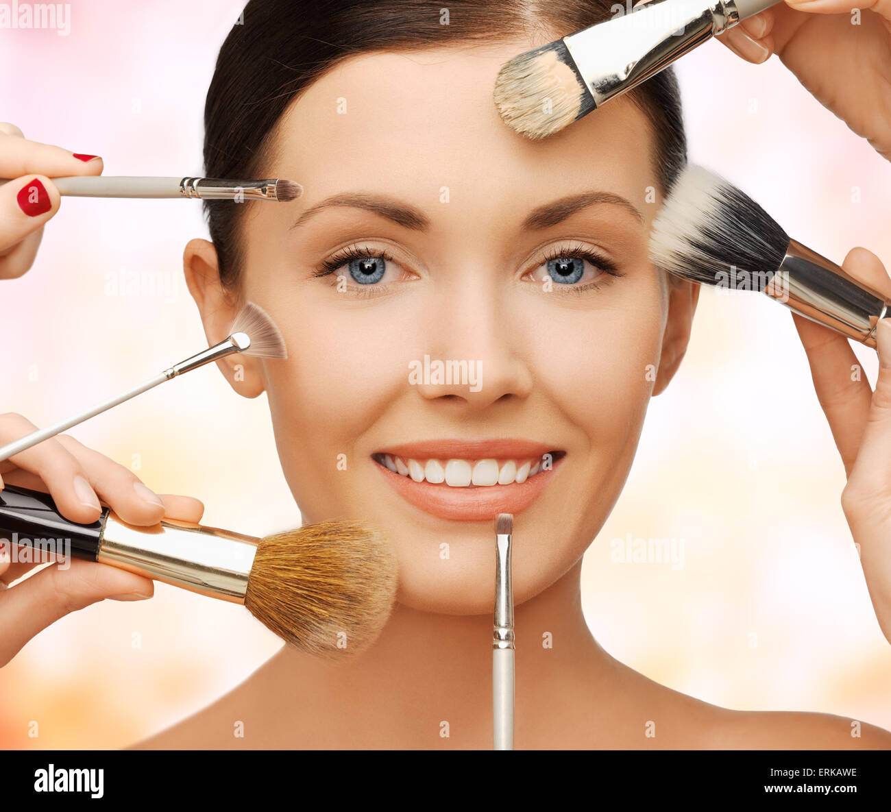 happy woman applying professional make-up Stock Photo - Alamy