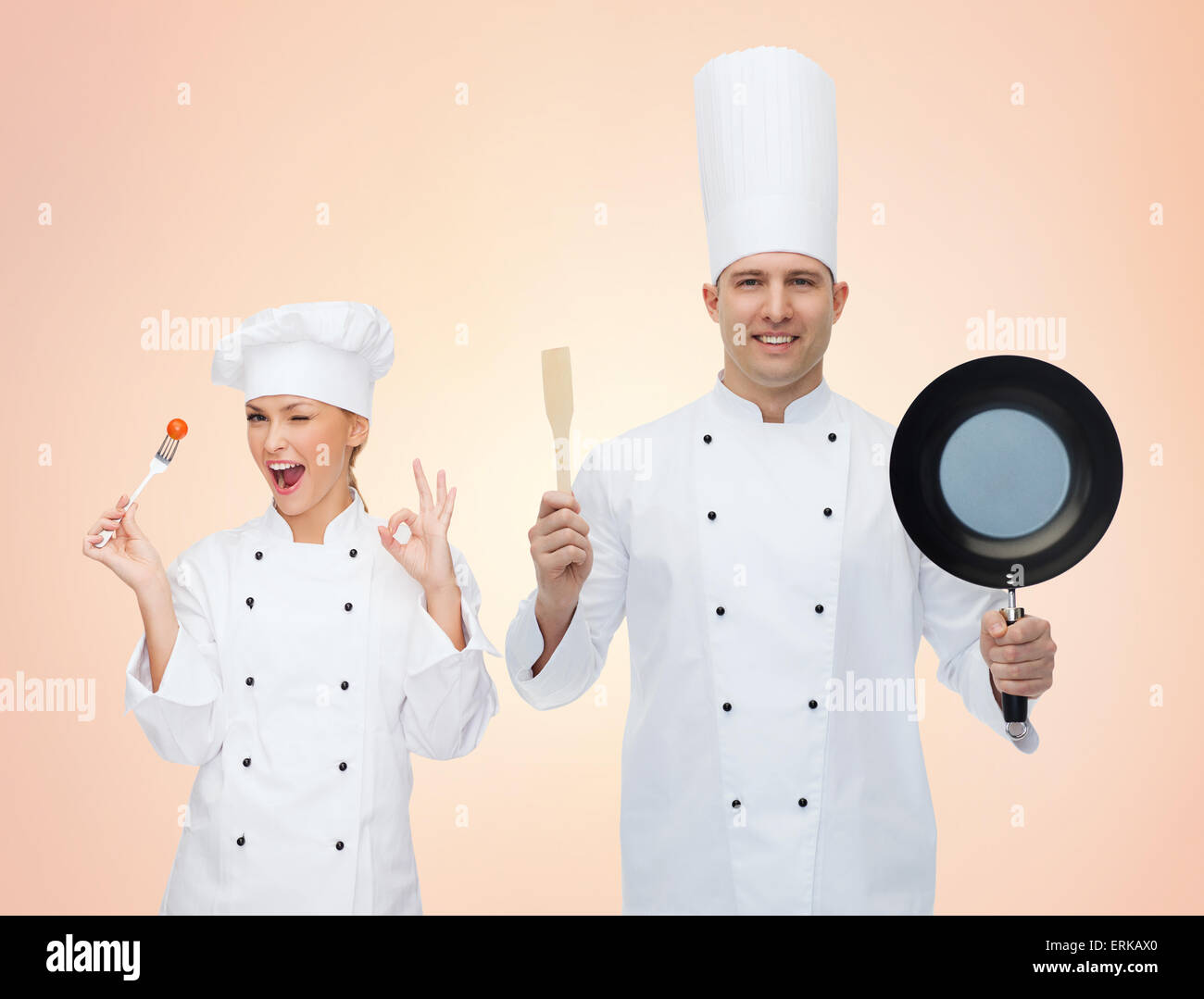 happy chefs or cooks couple with kitchenware Stock Photo - Alamy