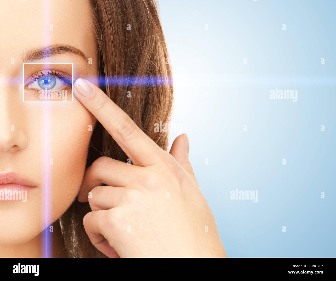 beautiful woman pointing to eye Stock Photo - Alamy