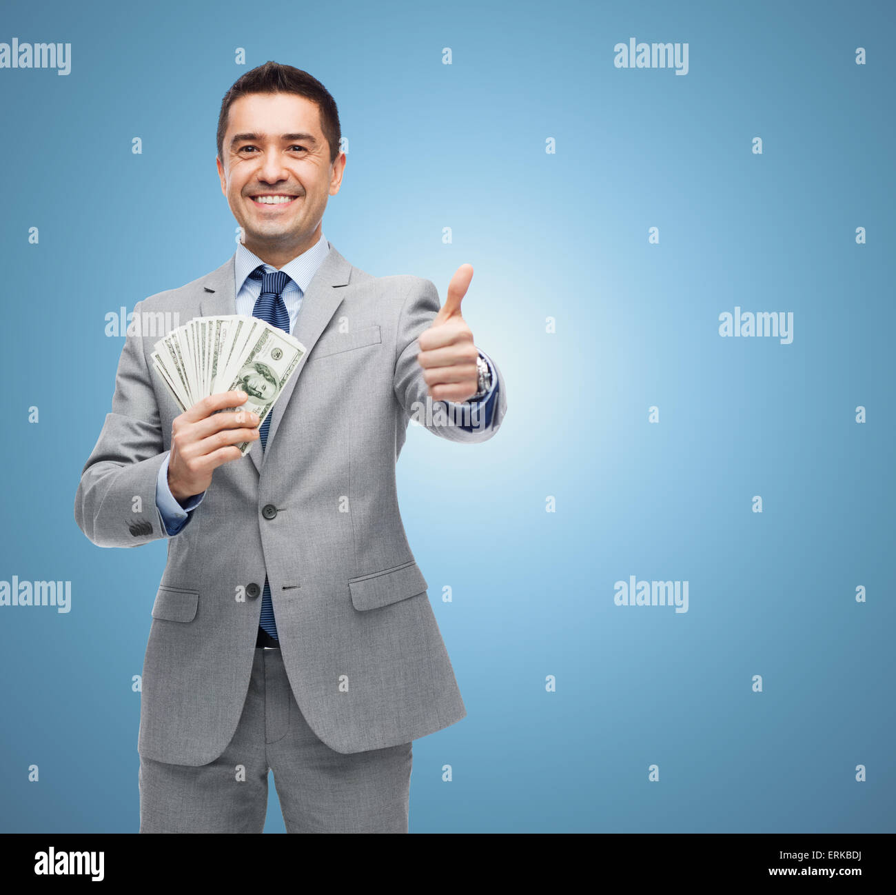 smiling businessman with money showing thumbs up Stock Photo - Alamy