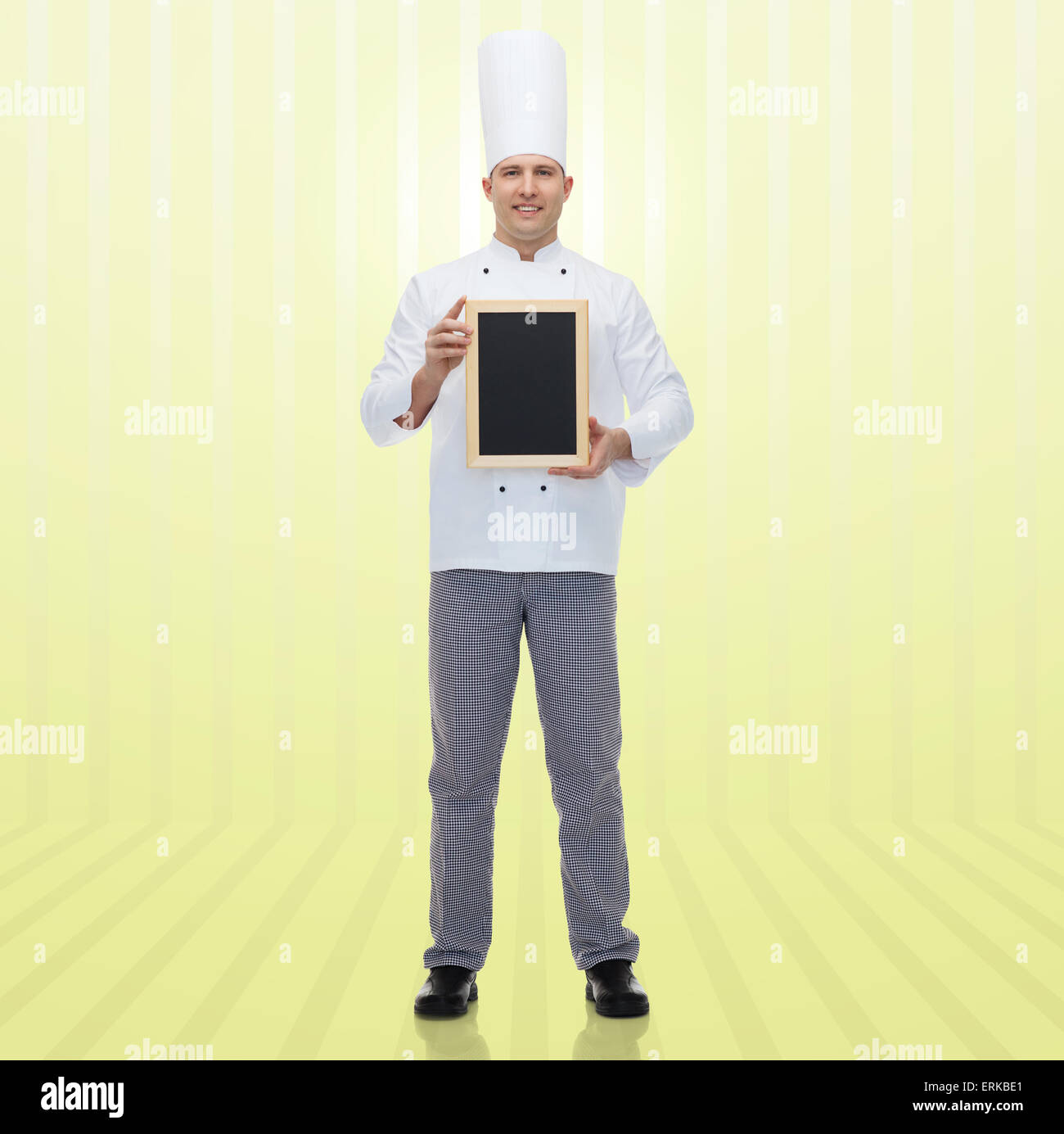 happy male chef cook holding blank menu board Stock Photo - Alamy