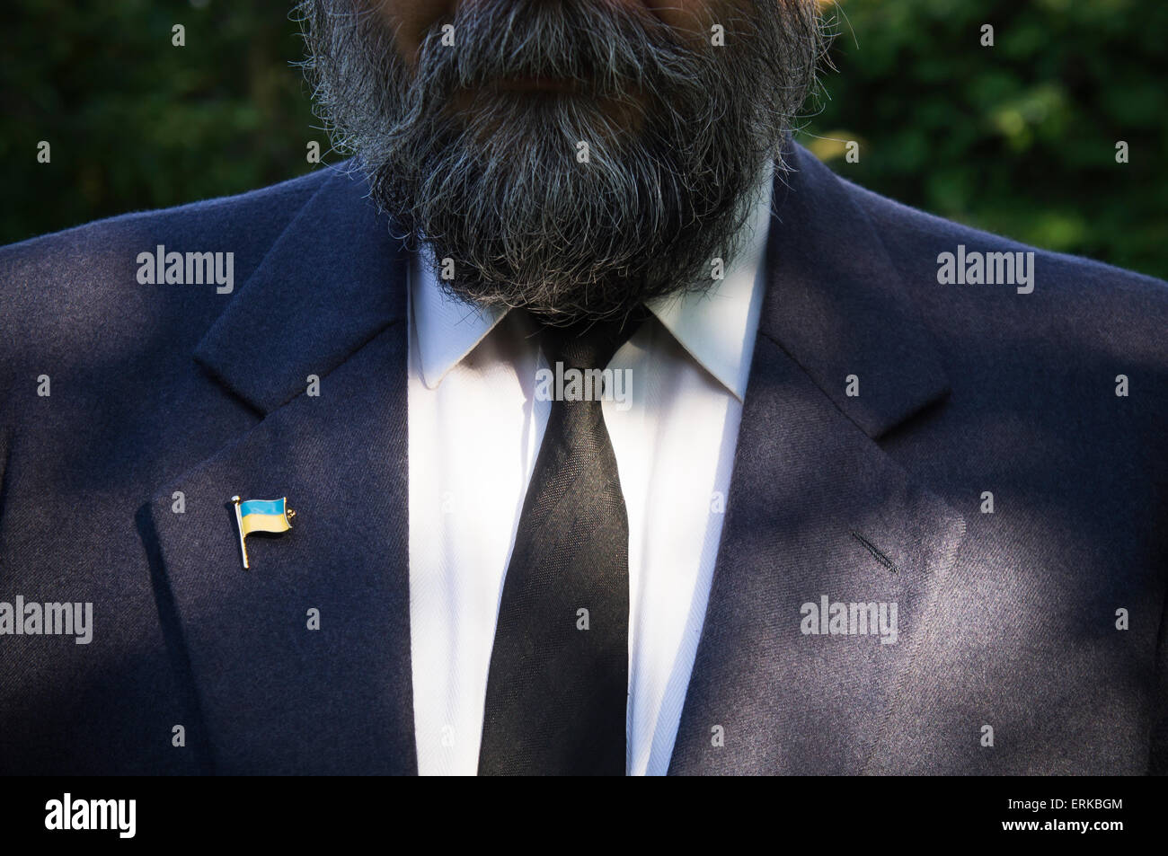 bearded man, beard, pepper-and-salt colour, jacket, Ukrainian flag ...