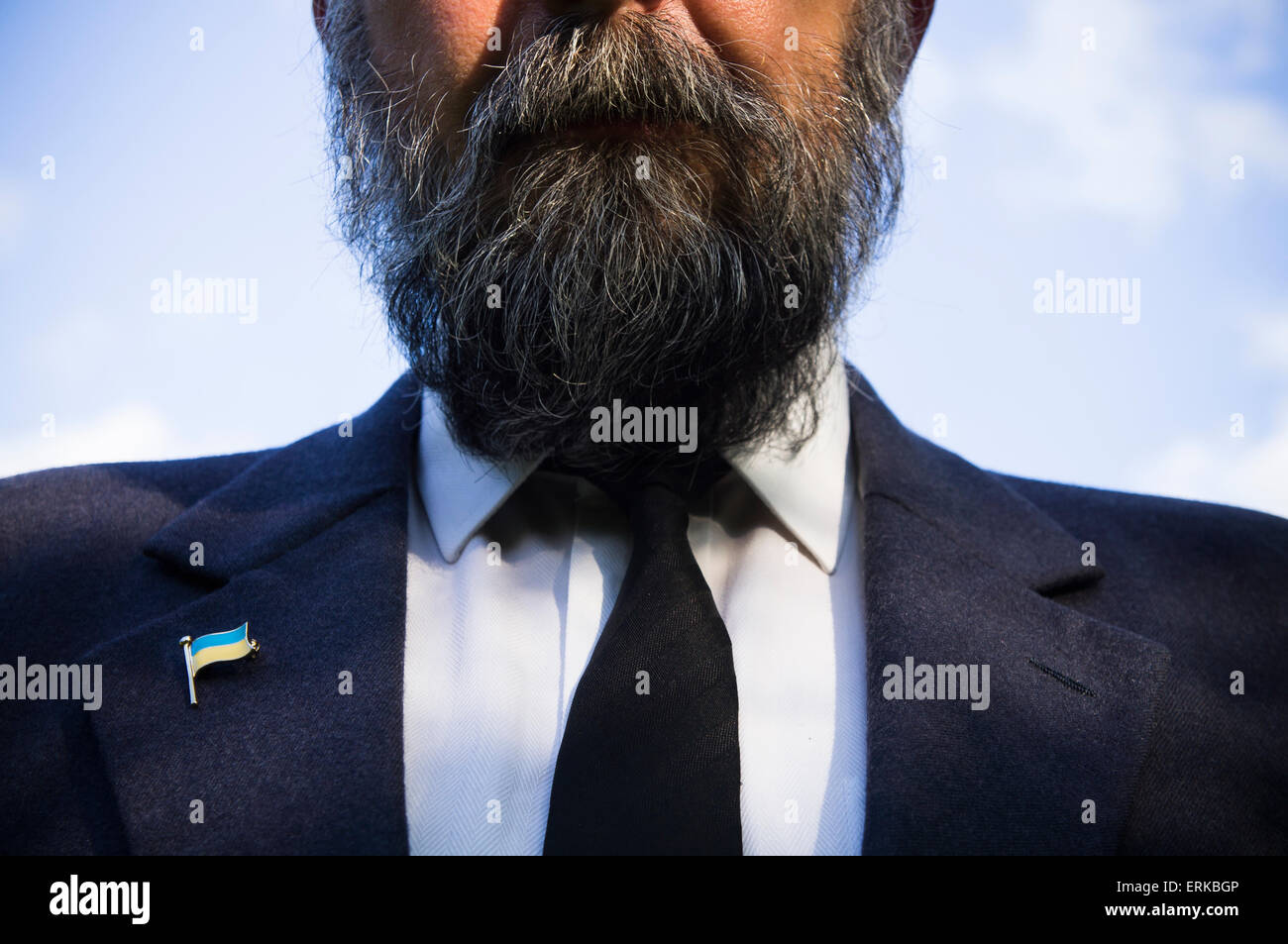 bearded man, beard, pepper-and-salt colour, jacket, Ukrainian flag ...