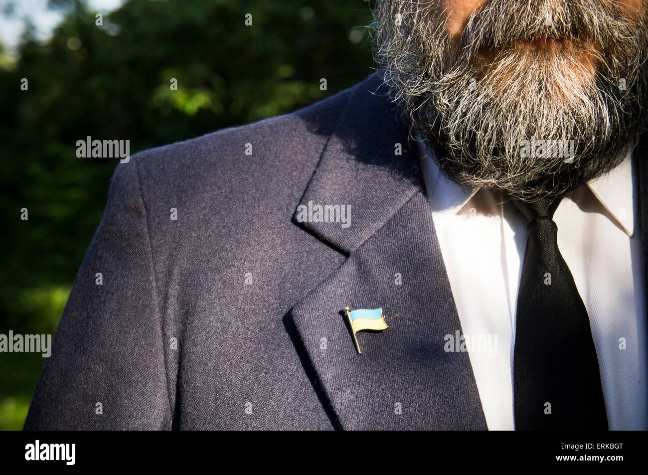 bearded man, beard, pepper-and-salt colour, jacket, Ukrainian flag ...