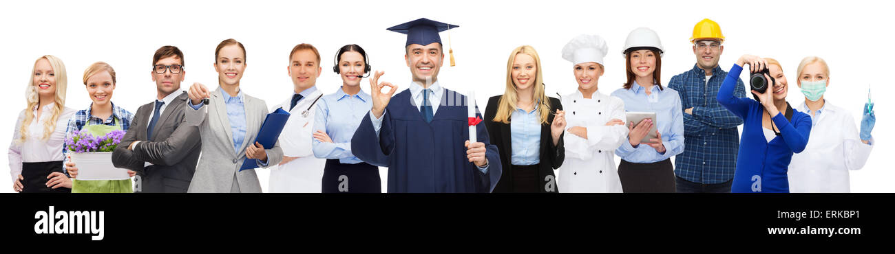 happy bachelor with diploma over professionals Stock Photo - Alamy