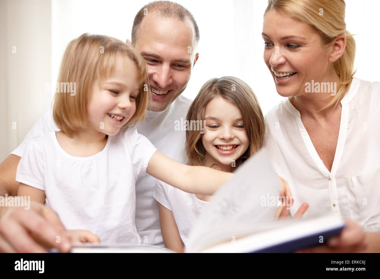 happy family reading book at home Stock Photo - Alamy