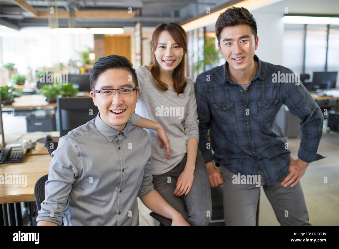 IT workers standing in office Stock Photo - Alamy