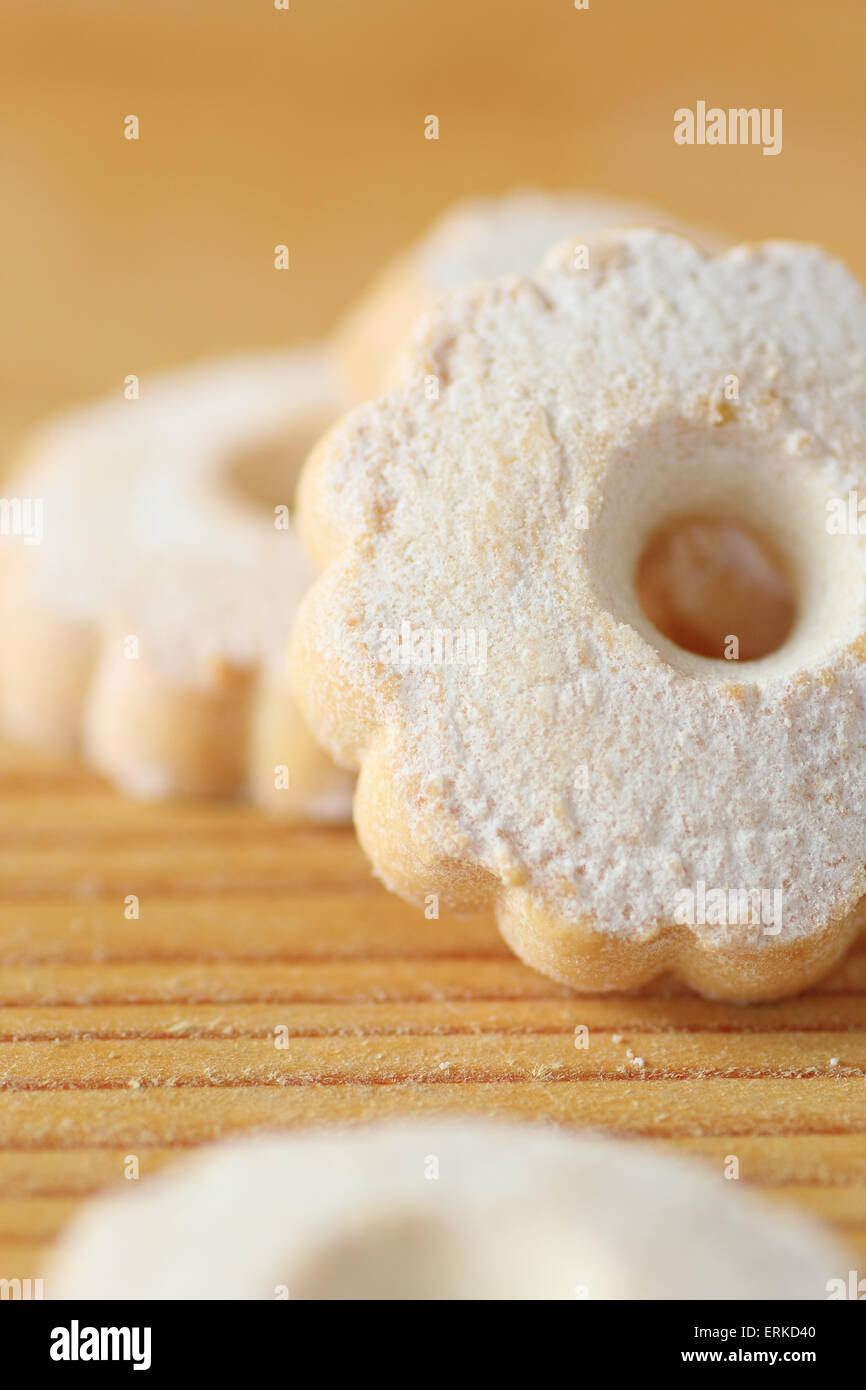Italian butter biscuits piled on a wooden table. These cookies have a ...