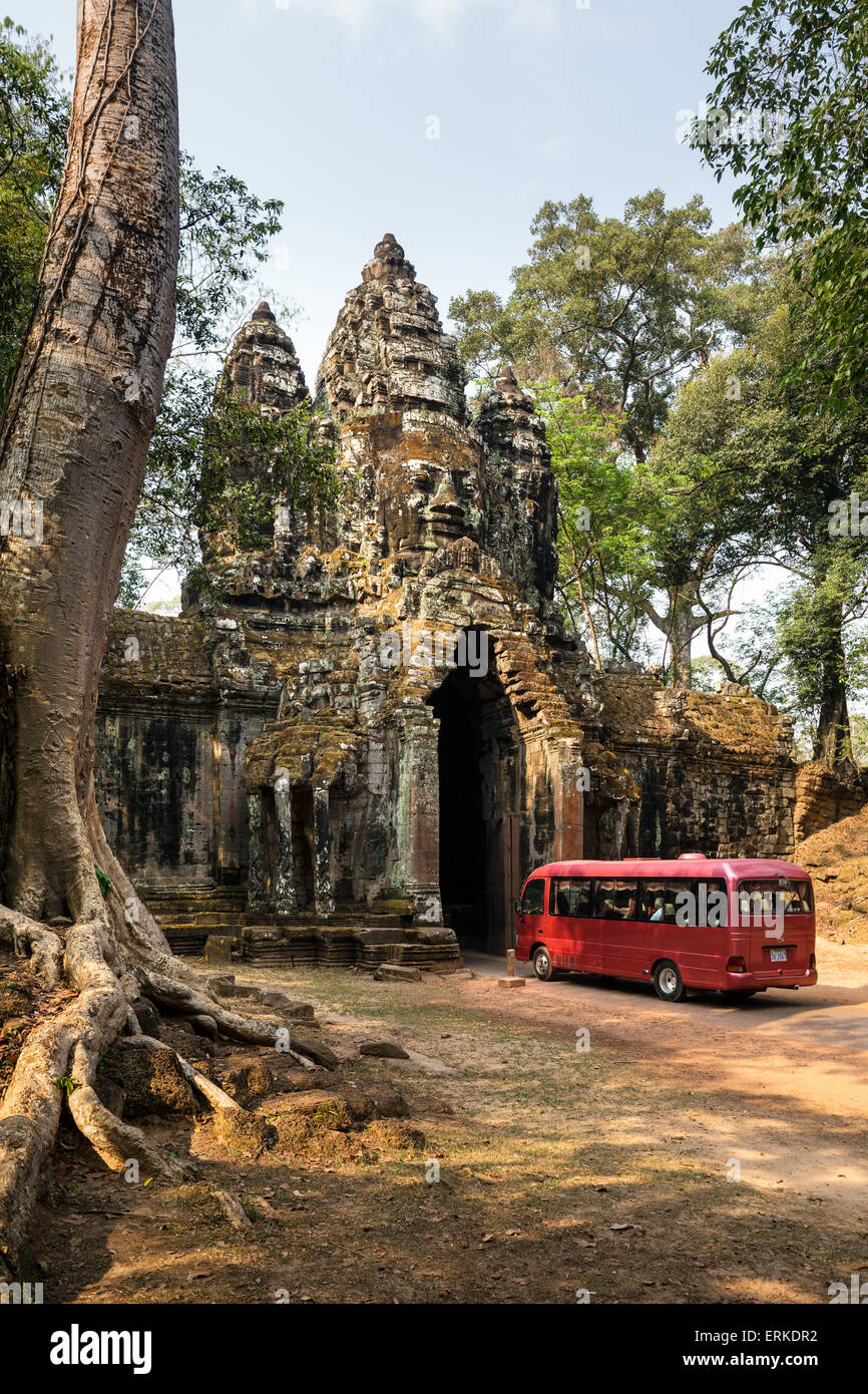 Bus in front of the north gate of Angkor Thom, Avalokiteshvara face ...
