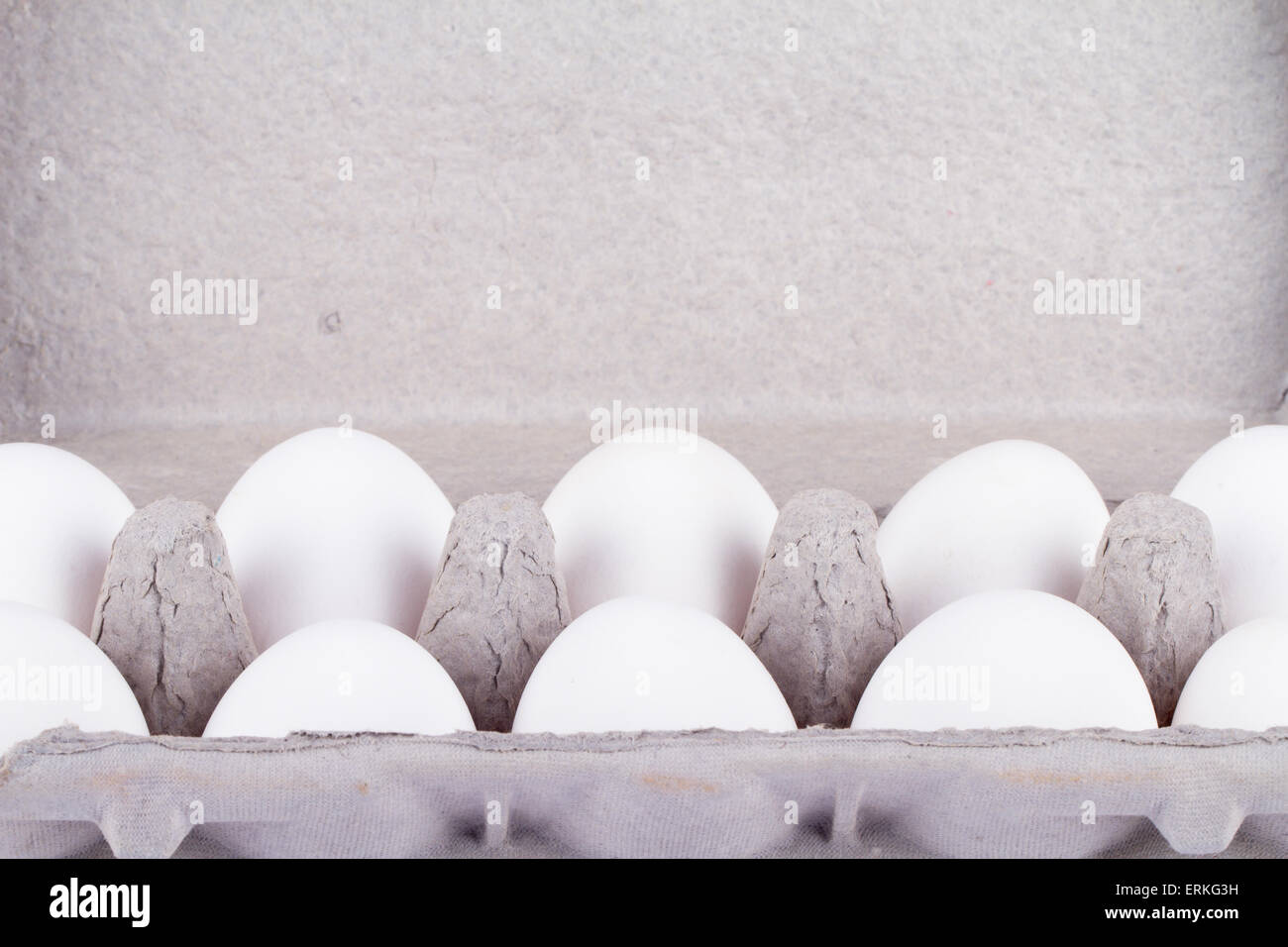 White eggs in carton with detailed front view, isolated on white ...