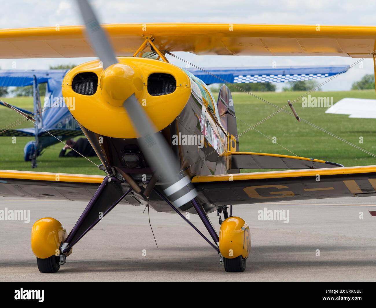 the pilot of a Pitts Special aerobatic biplane looks out of the cockpit ...
