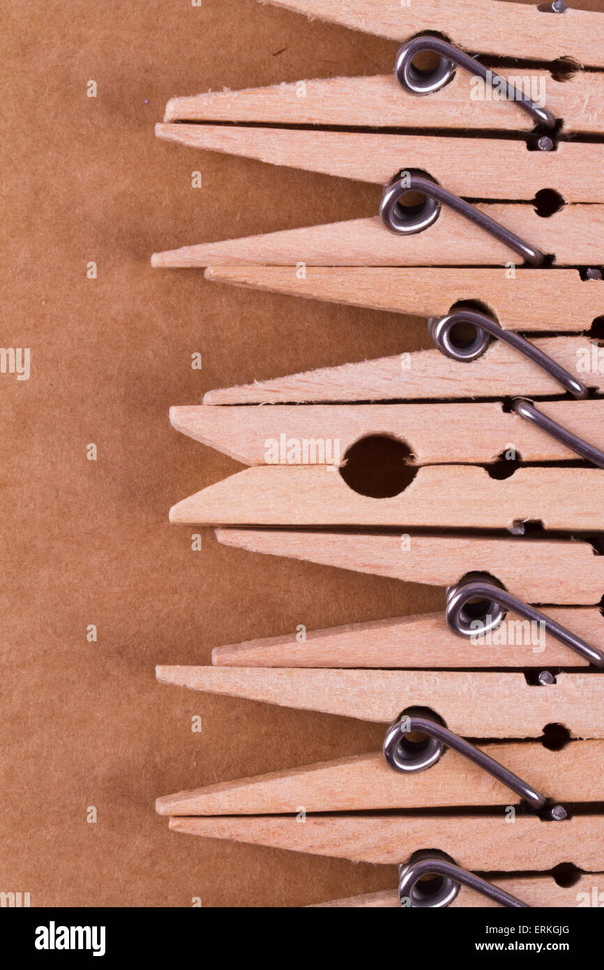 Detailed close up top view of wooden clothespins, on paperboard ...
