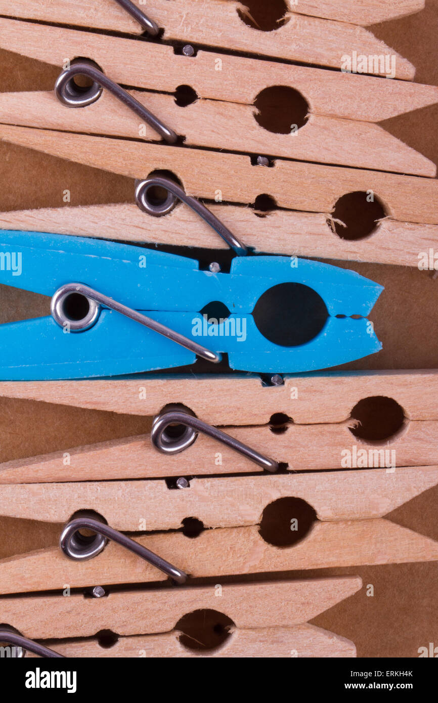 Detailed close up top view of wooden clothespins with a blue one, on ...