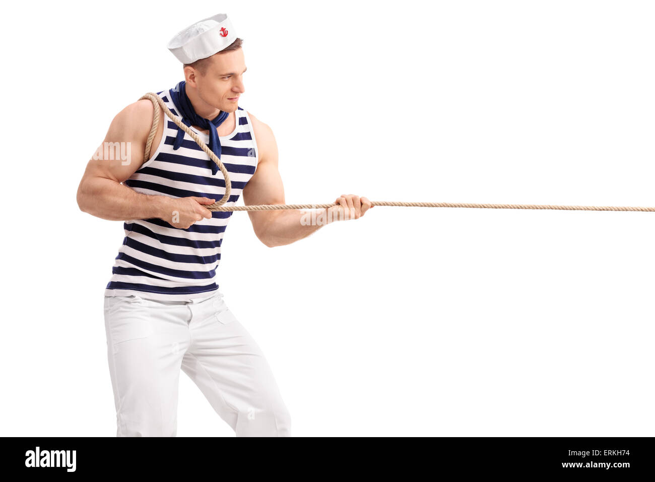 Studio shot of a young man in sailor uniform pulling a rope isolated on ...