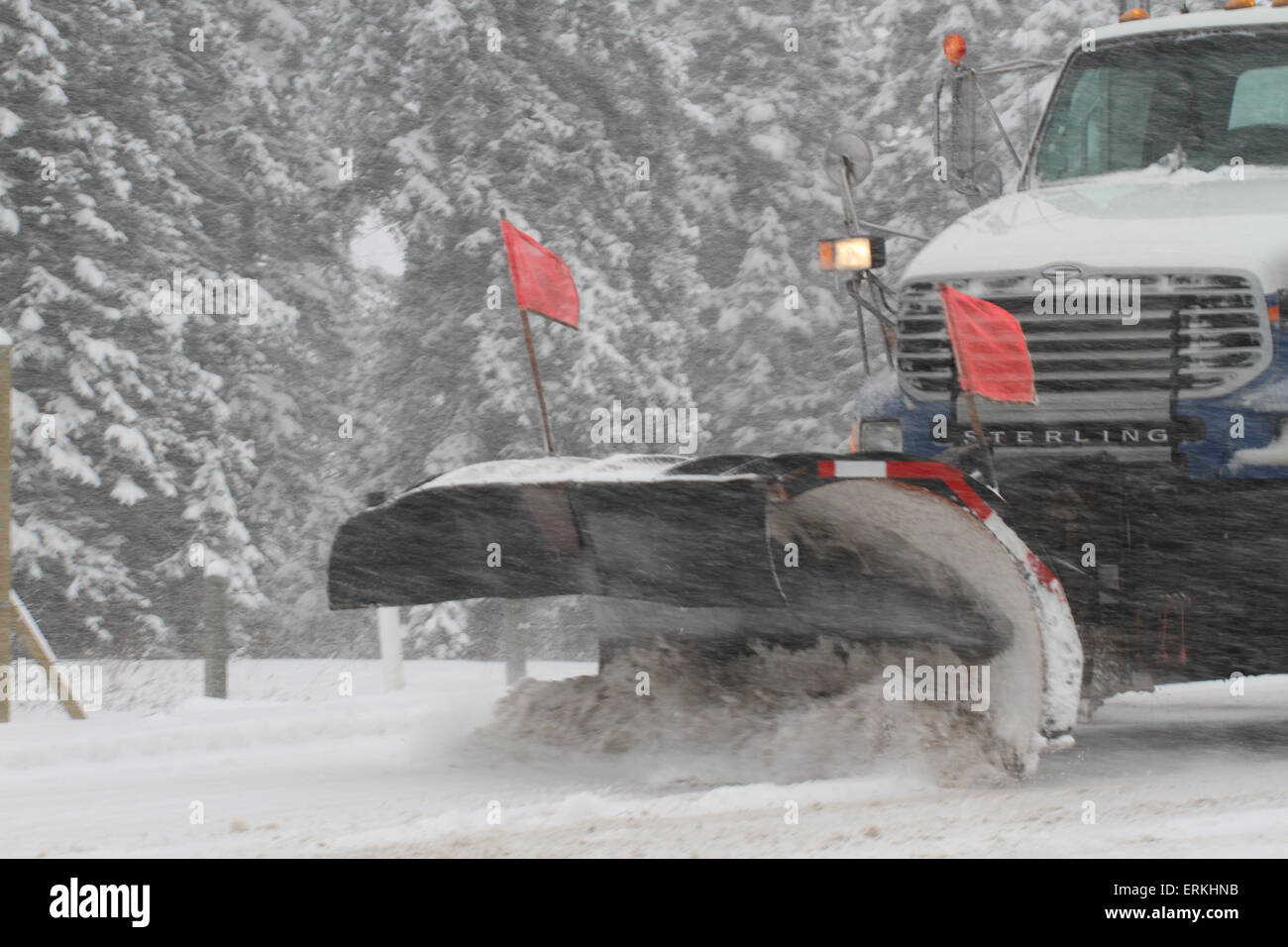 Snow plow clearing a road Stock Photo - Alamy