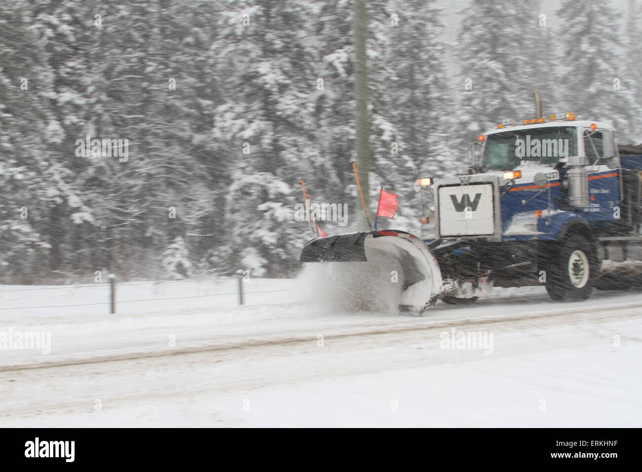 Snow plow clearing a road Stock Photo - Alamy