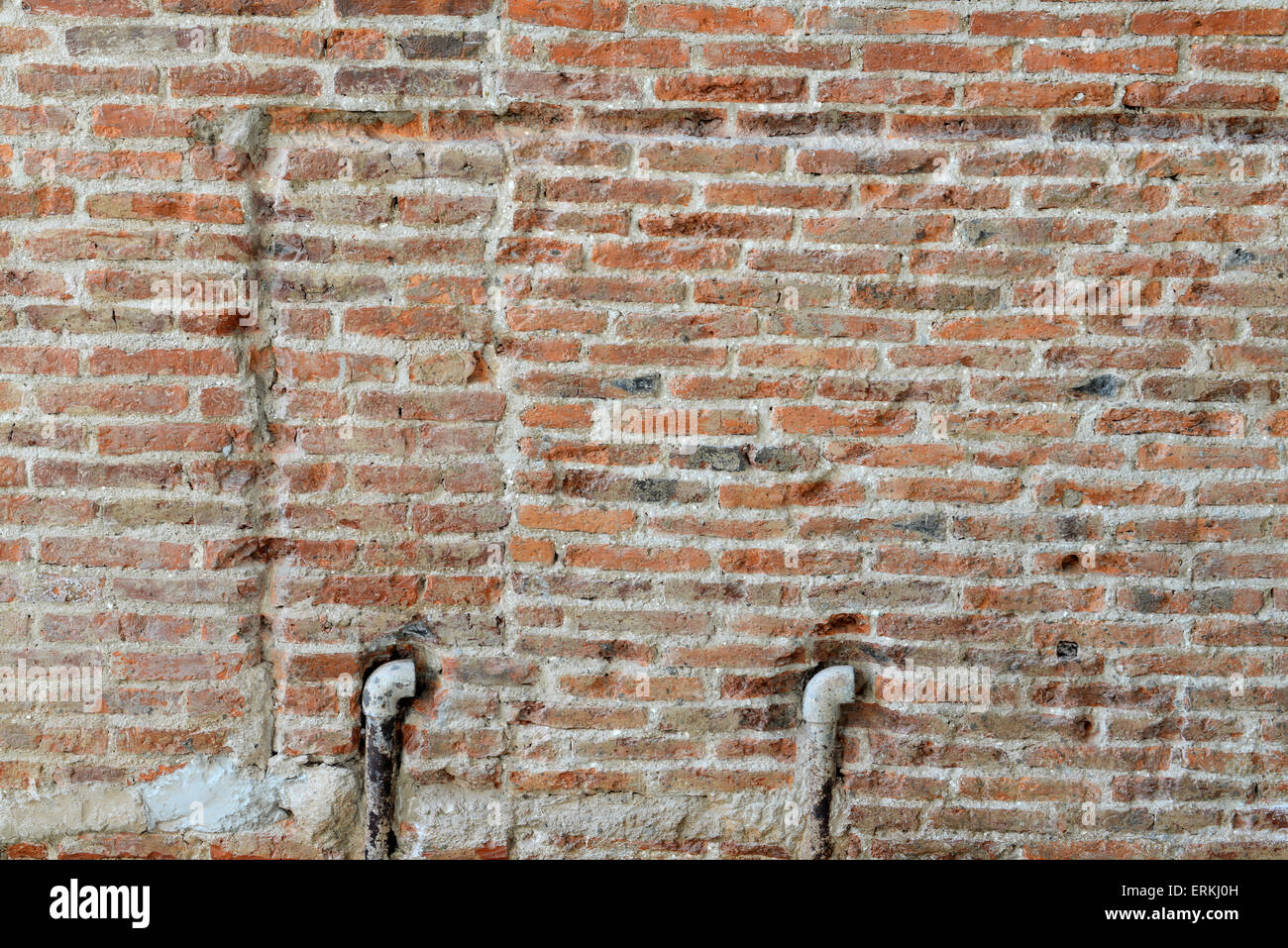 Old brick wall and pipe on concrete texture, background for decorate ...