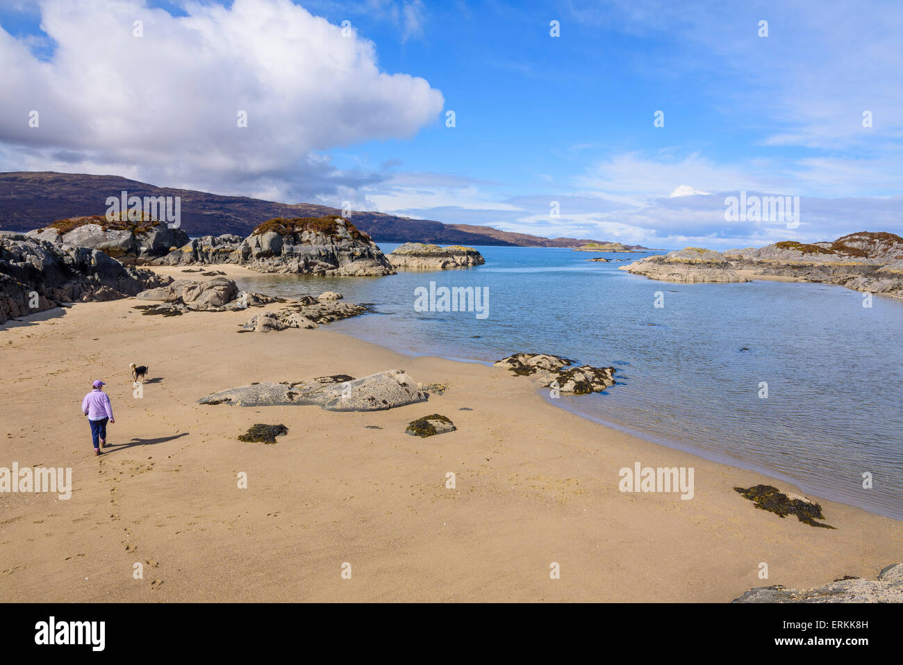 Woman and dog on Ardtoe beach, Ardnamurchan Peninsula, Lochaber ...