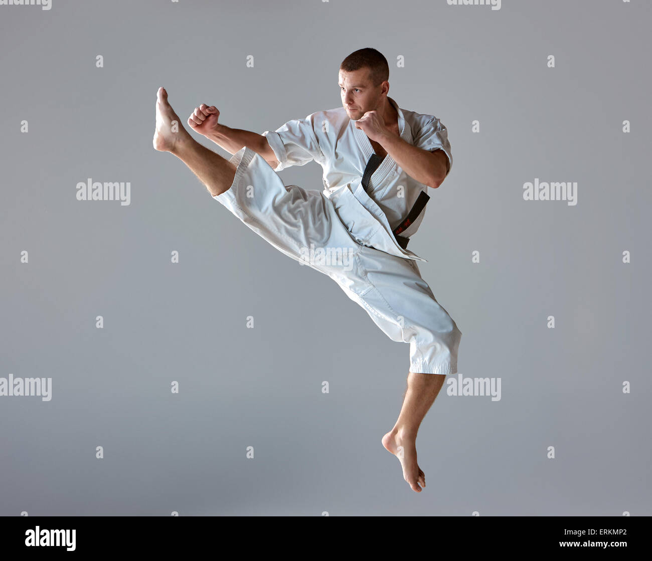 Man in white kimono training karate Stock Photo - Alamy