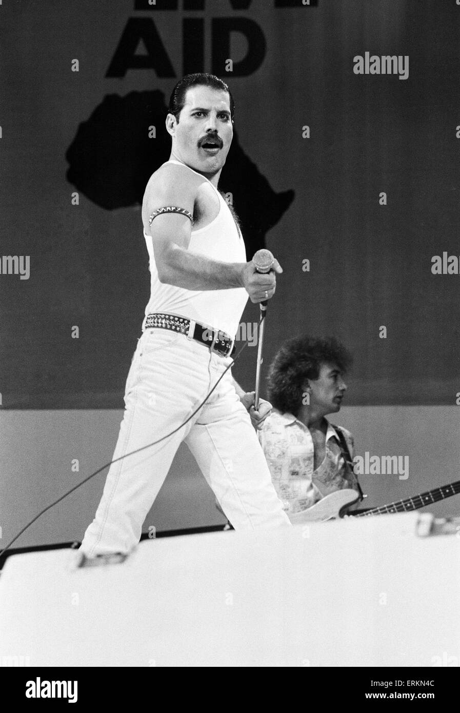Freddie Mercury, lead singer of British rock group Queen, performing on ...