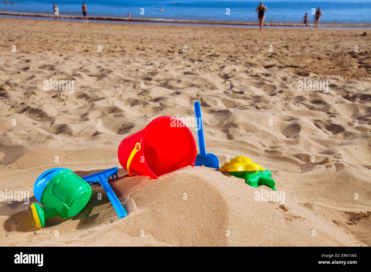 beach toys in sand on sea shore Stock Photo - Alamy