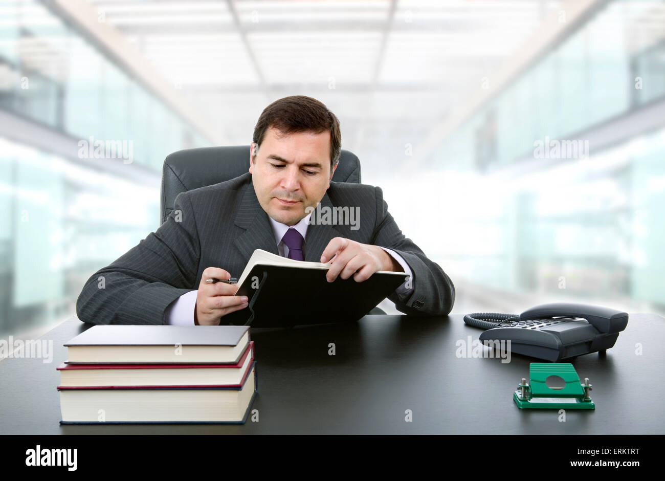 businessman writing on a desk, at the office Stock Photo - Alamy