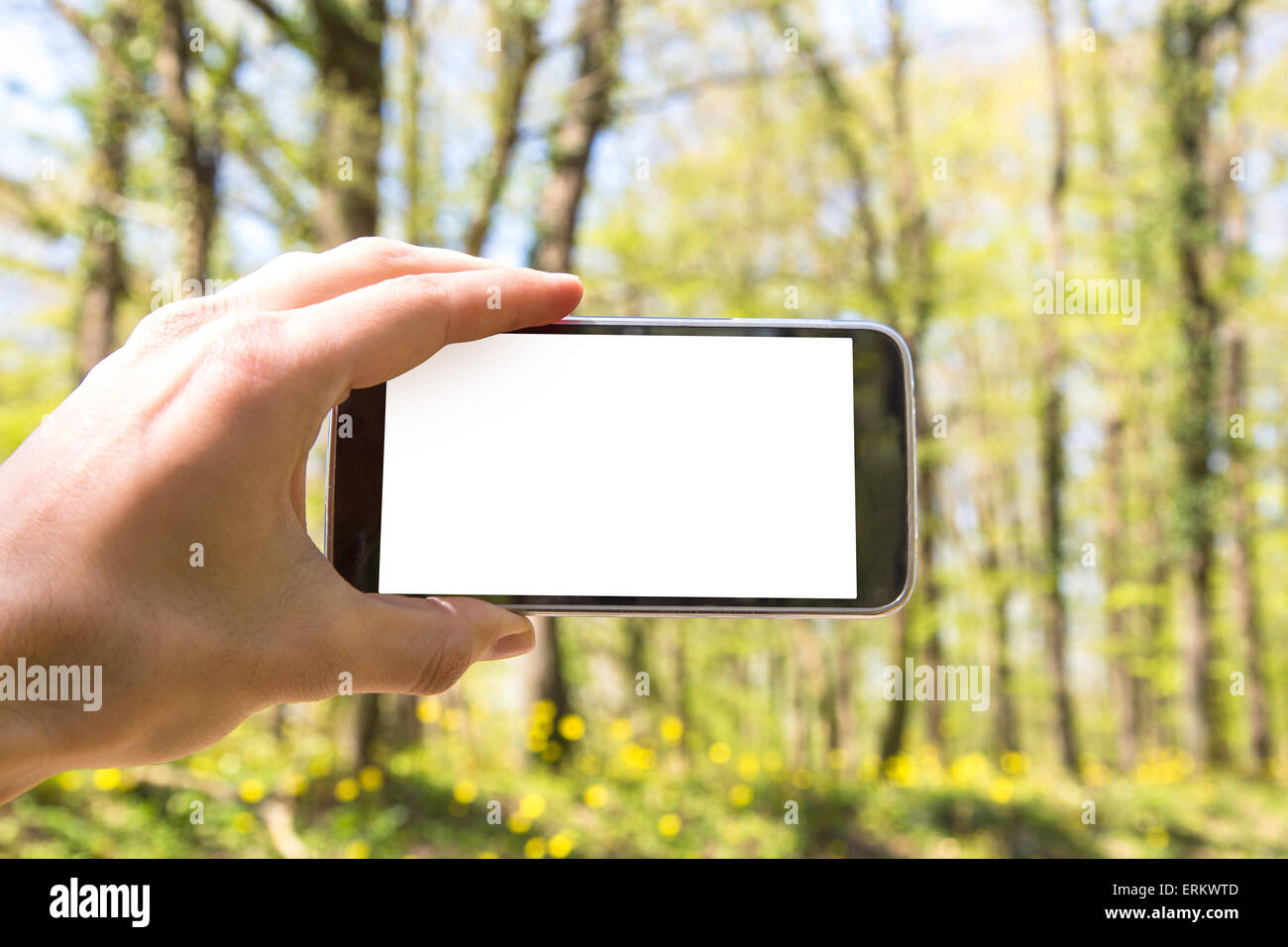 Front view of hand holding horizontal black smartphone with white black ...