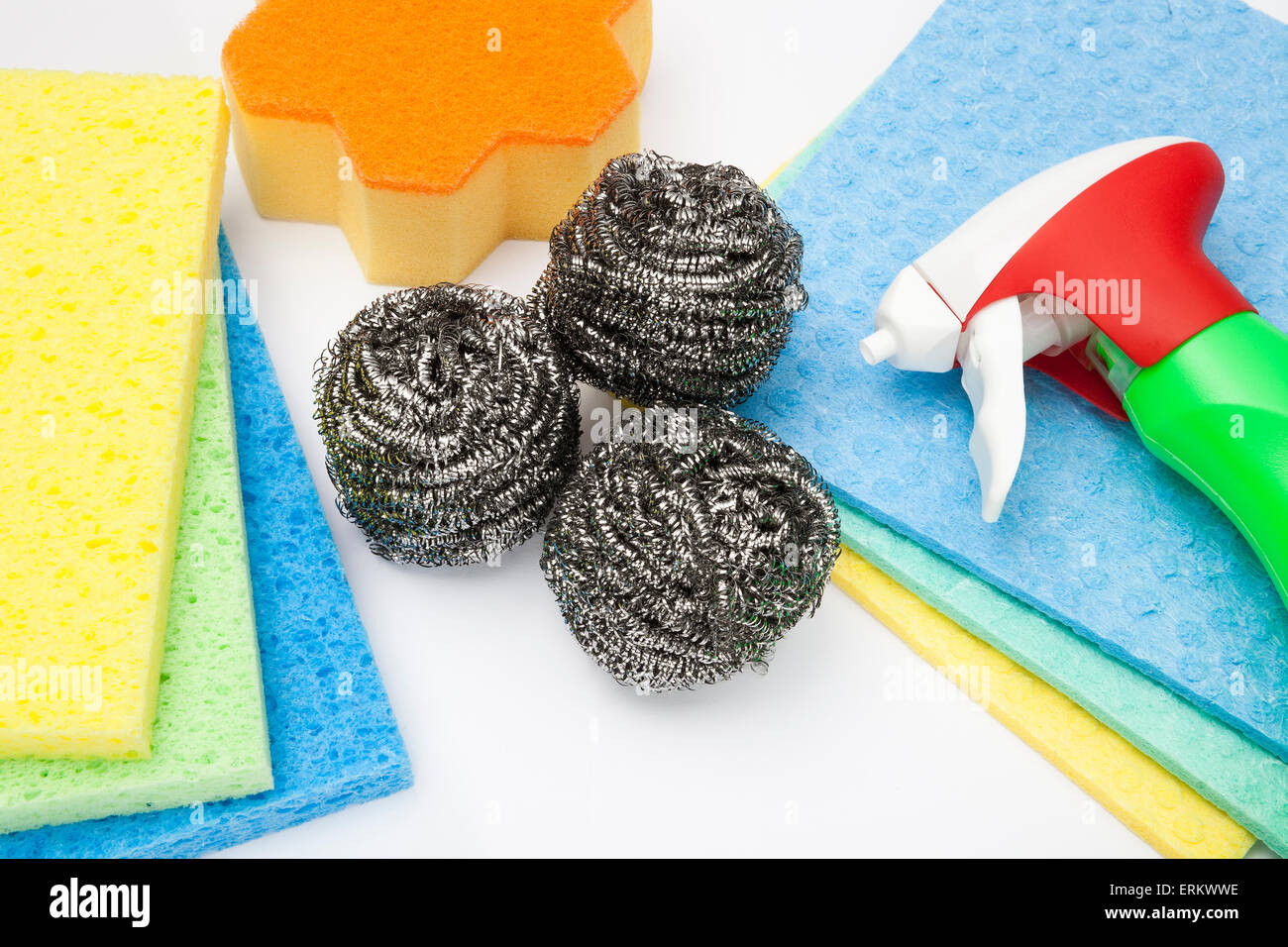 Cleaning product containers and sponges isolated on a white background ...