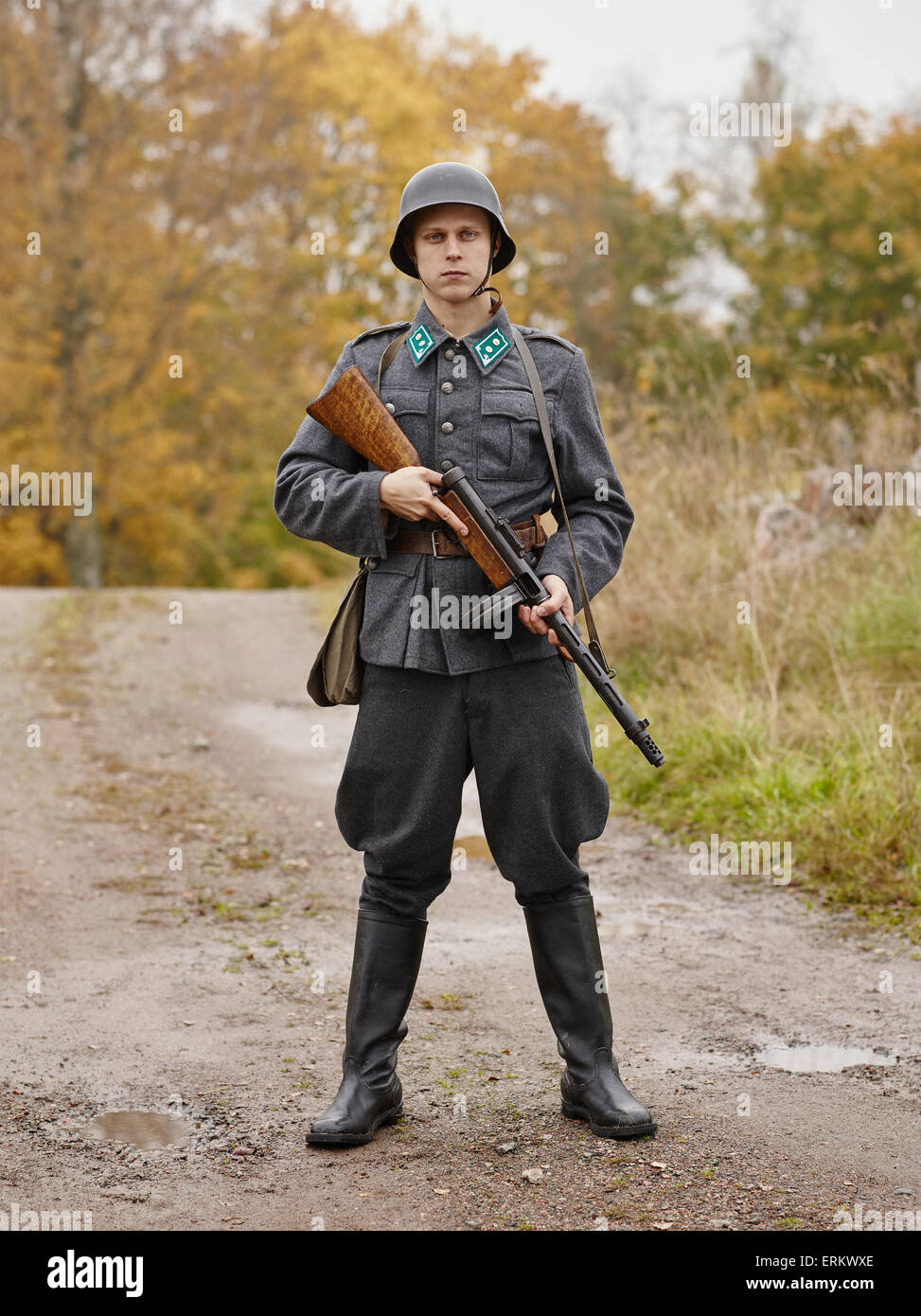 Historic costume theme World War II, Finnish soldier and Submachine-gun ...