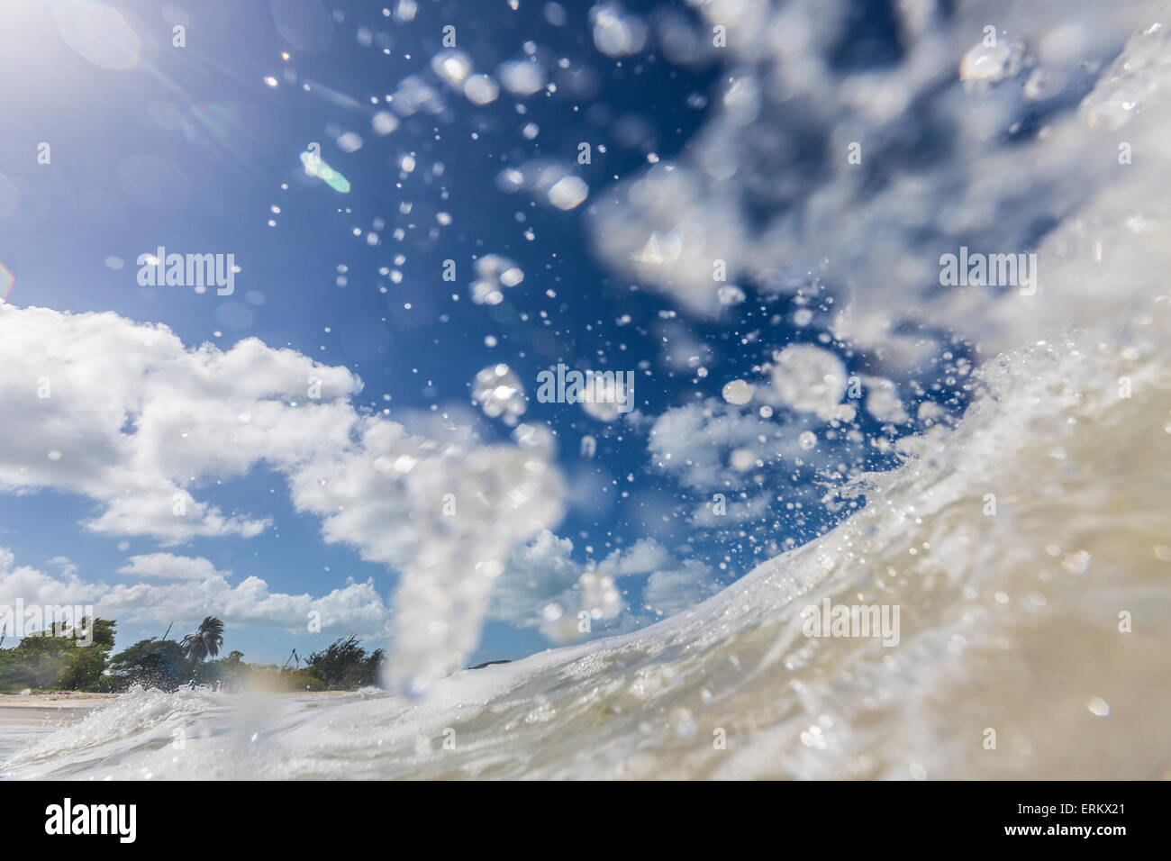 A wave of the Caribbean Sea breaks in front of Fort James at the ...