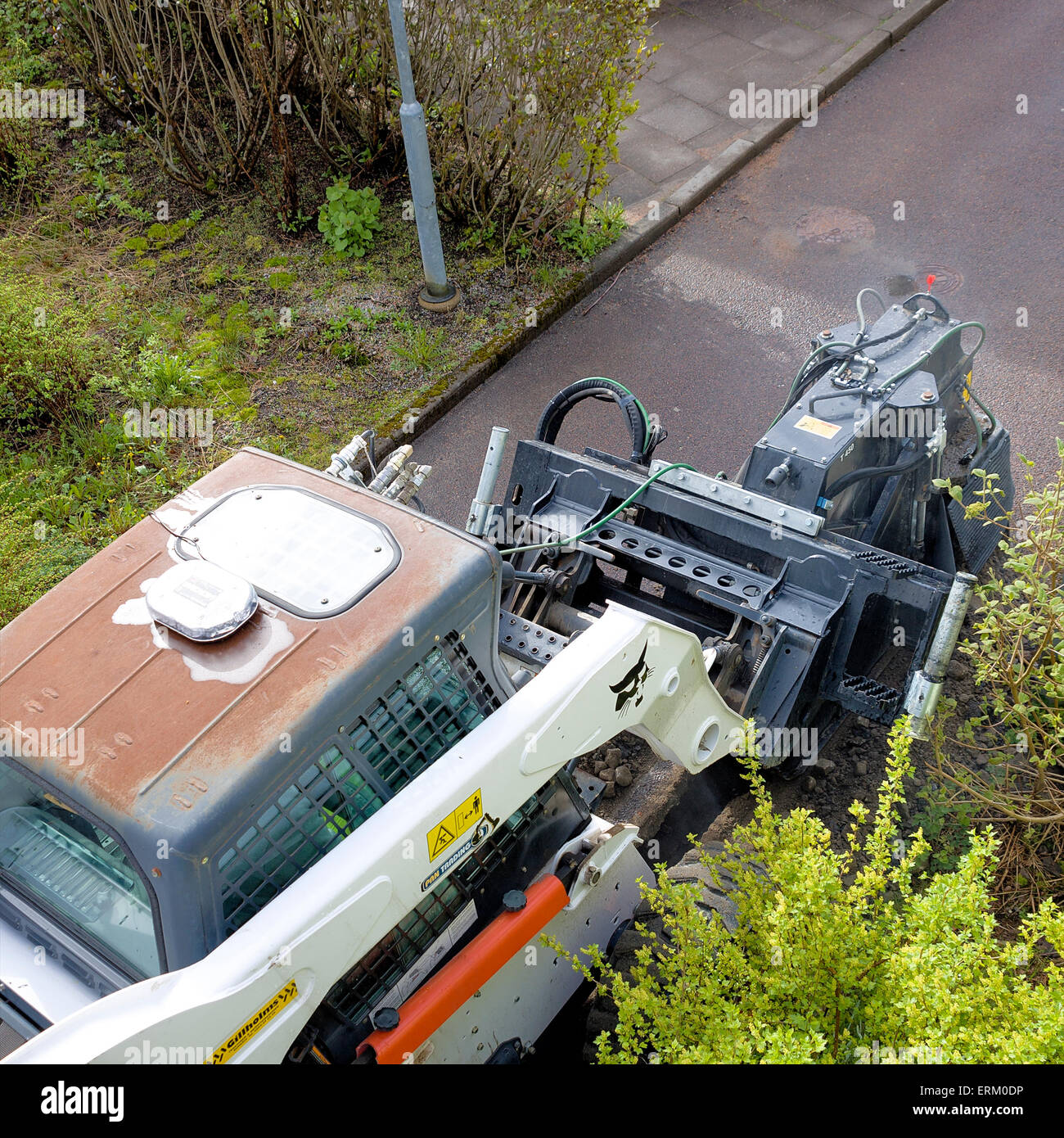 Trench digger trenching in preparation for high speed fiber internet ...