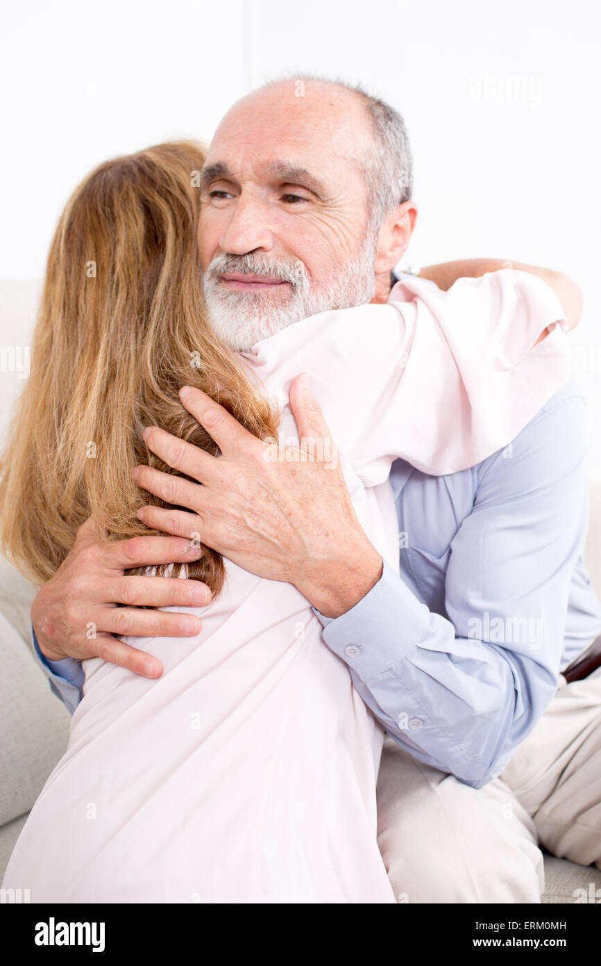 Hug between two elderly persons Stock Photo - Alamy