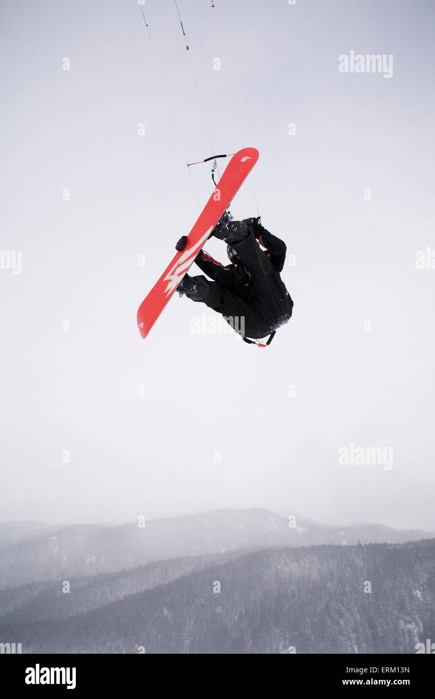 A mid adult man gets air while snow kiting in Alaska Stock Photo - Alamy