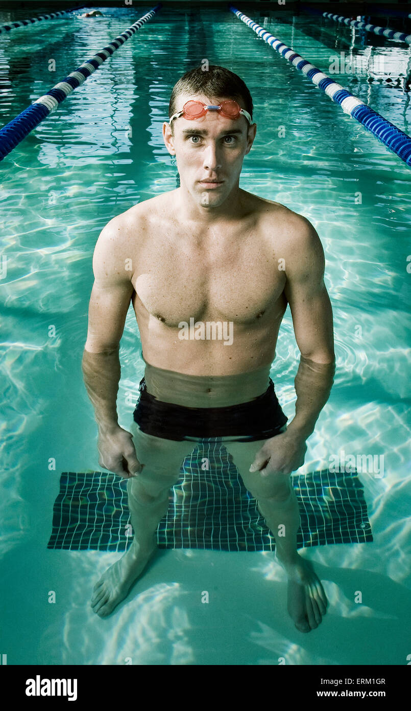 James Logan a competitive swimmer standing in the pool getting ready to ...