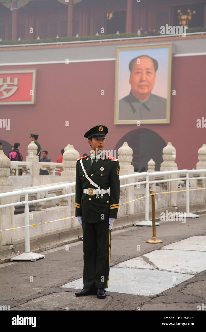 A policeman standing guard at the Gate of Heavenly Peace in Beijing ...